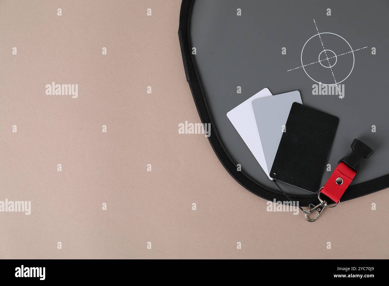 White balance calibration cards on beige background, top view. Space ...