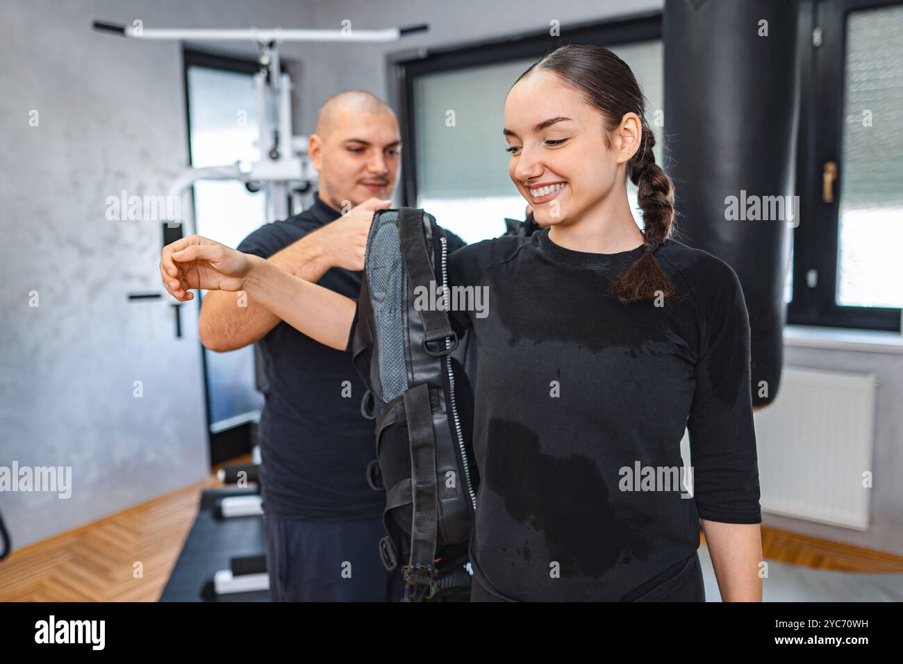 Gym training with electrical muscle stimulation Stock Photo - Alamy