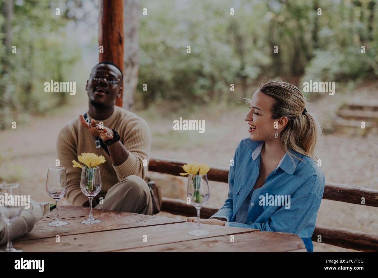 Two friends sharing laughter and conversation outdoors Stock Photo - Alamy