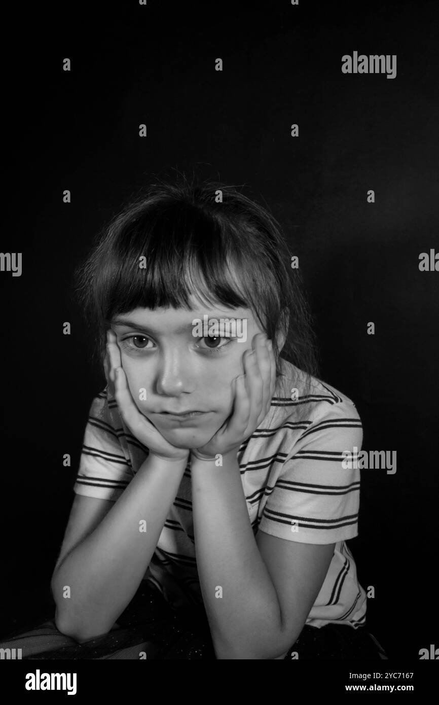 Young girl model looking sad facing away from camera Stock Photo - Alamy