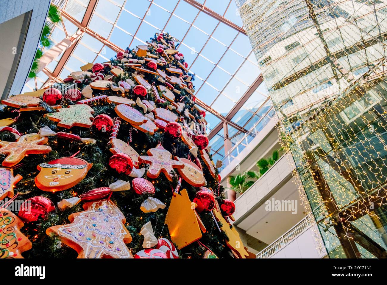 Large decorated Christmas tree inside a shopping center to encourage ...