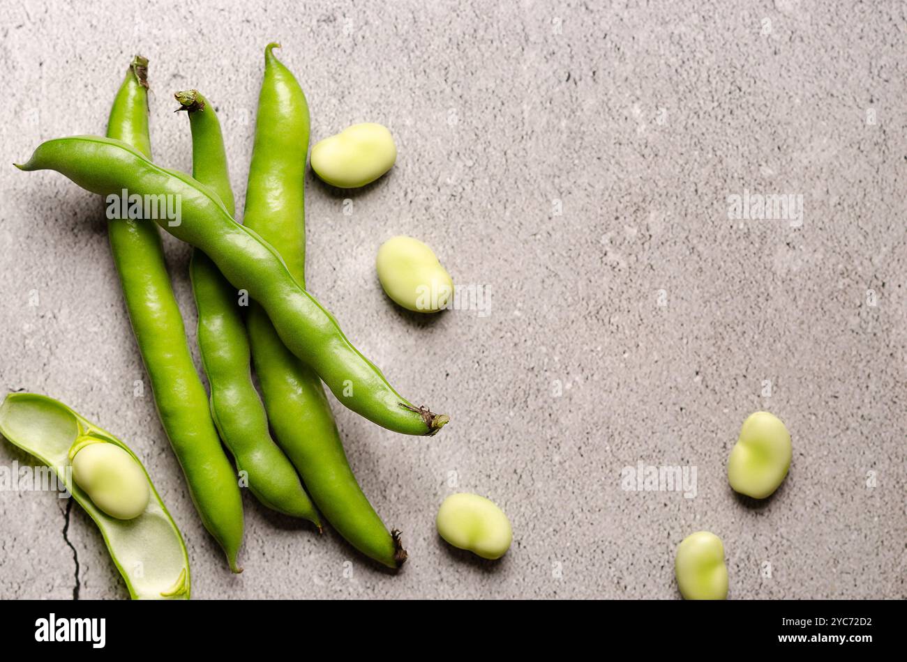 Fresh fava beans on a grey stony background with copy space Stock Photo ...