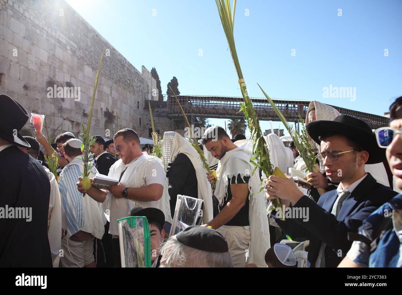 Crowd of Jewish men with prayer shawls or Talith pray at the Western ...