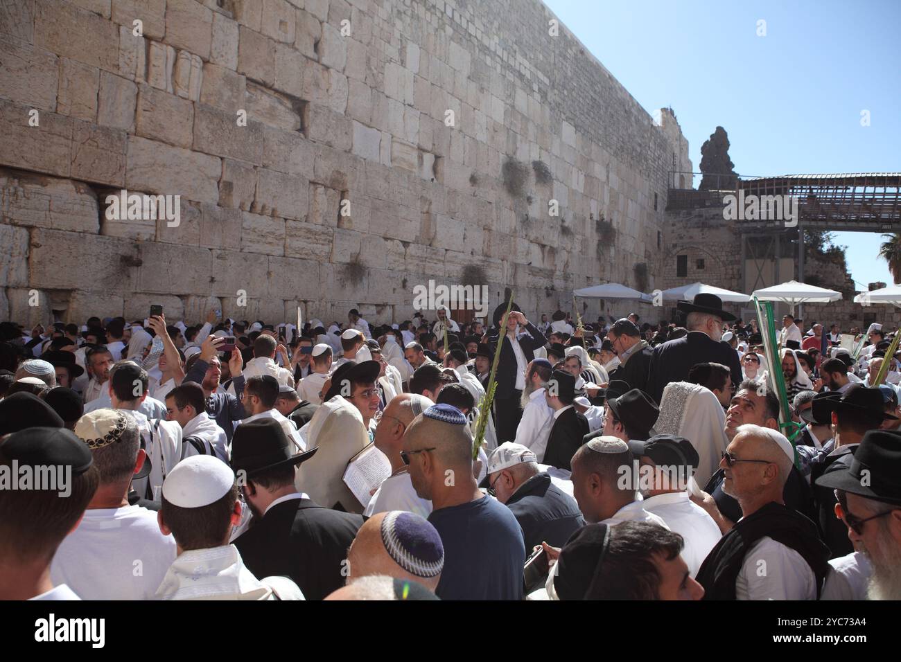 Crowd of Jewish men with prayer shawls or Talith pray at the Western ...