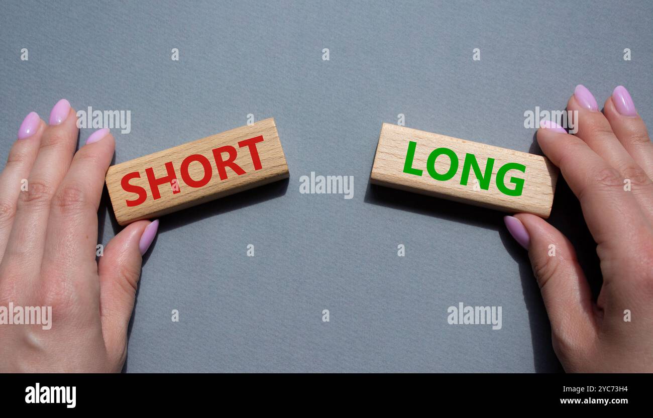Short vs Long symbol. Concept word Short vs Long on wooden blocks ...
