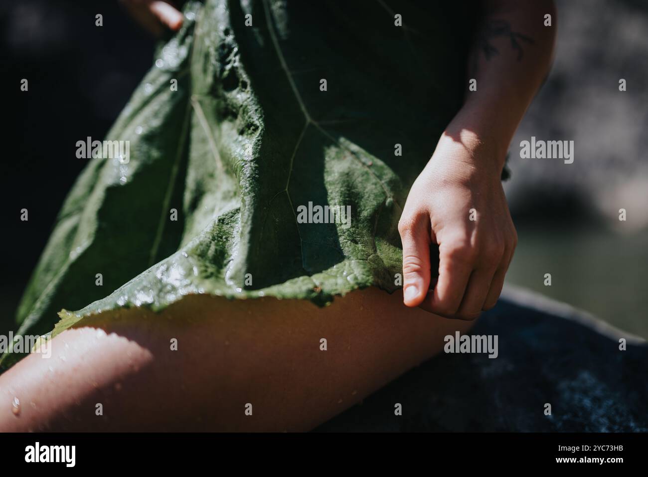 Person in green clothing hi-res stock photography and images - Alamy