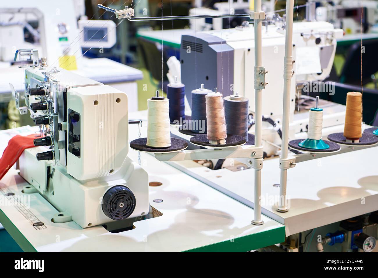Sewing workshop with threads and machines Stock Photo - Alamy