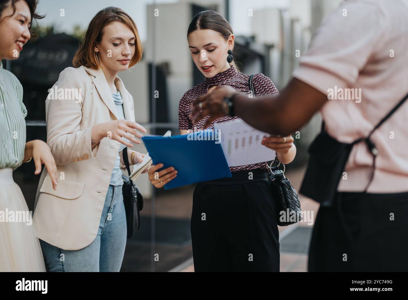 Multicultural team collaboration during outdoor business meeting Stock ...