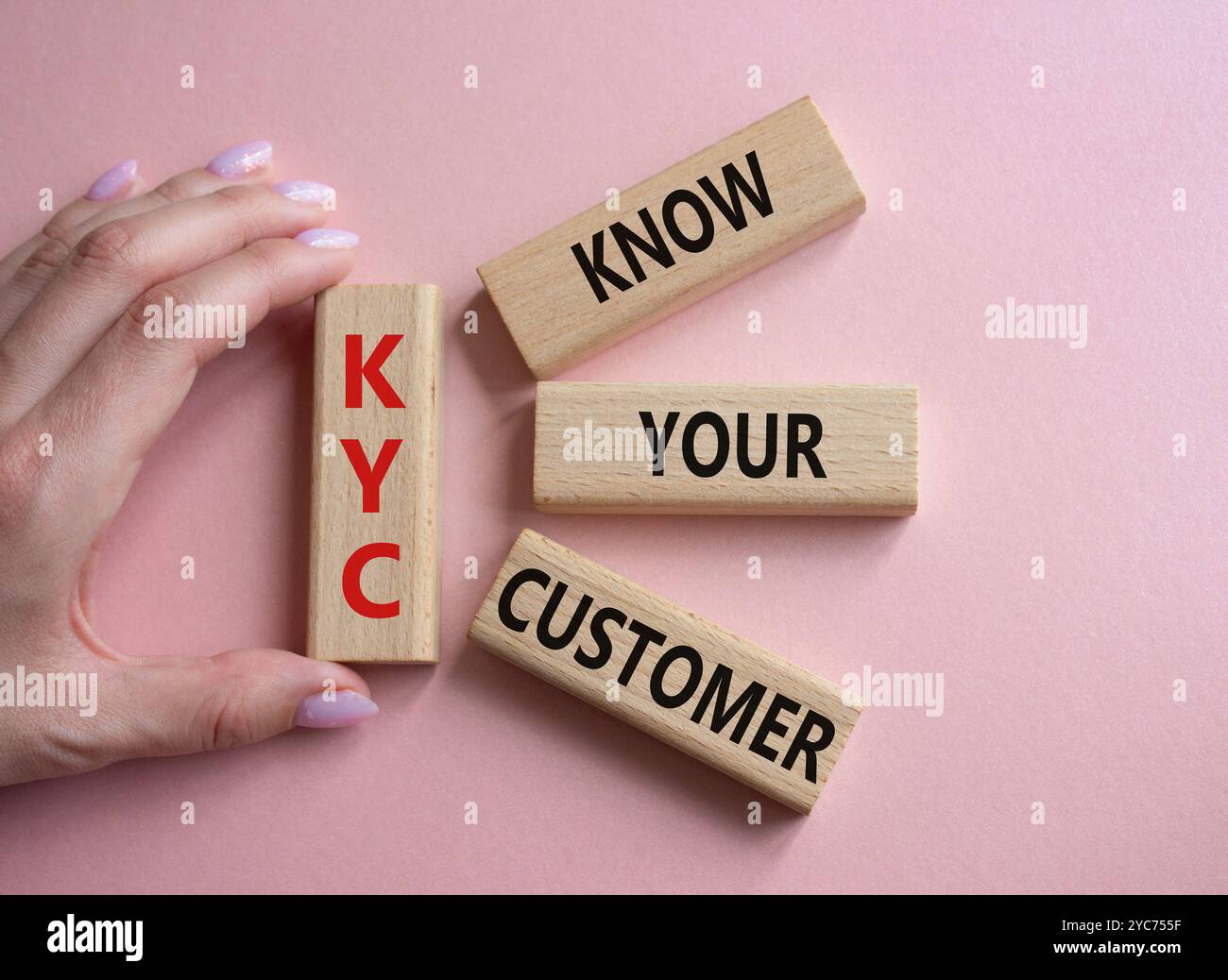 KYC - Know Your Customer. Wooden cubes with word KYC. Businessman hand ...
