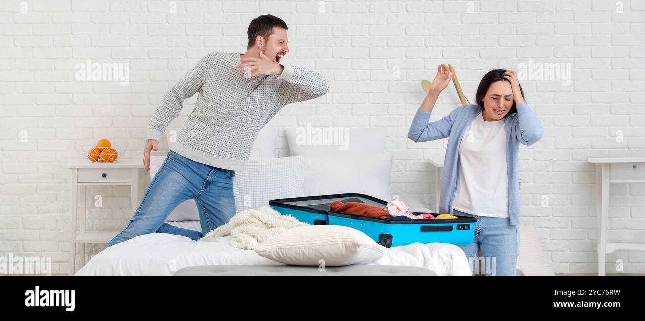 Angry husband beating his scared wife in bedroom. Domestic violence ...