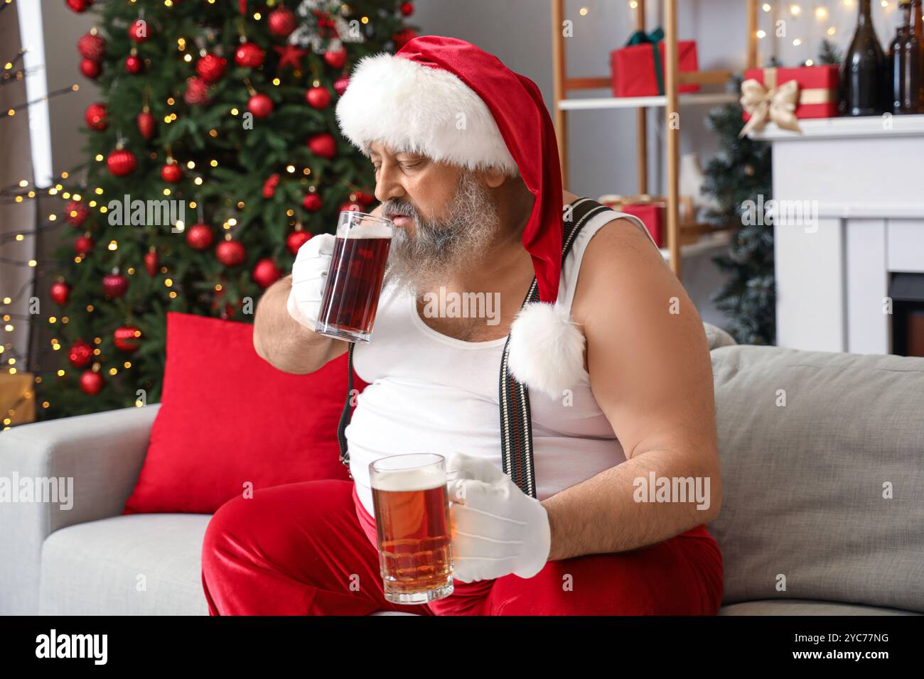 Bad Santa Claus drinking beer at Christmas party Stock Photo - Alamy