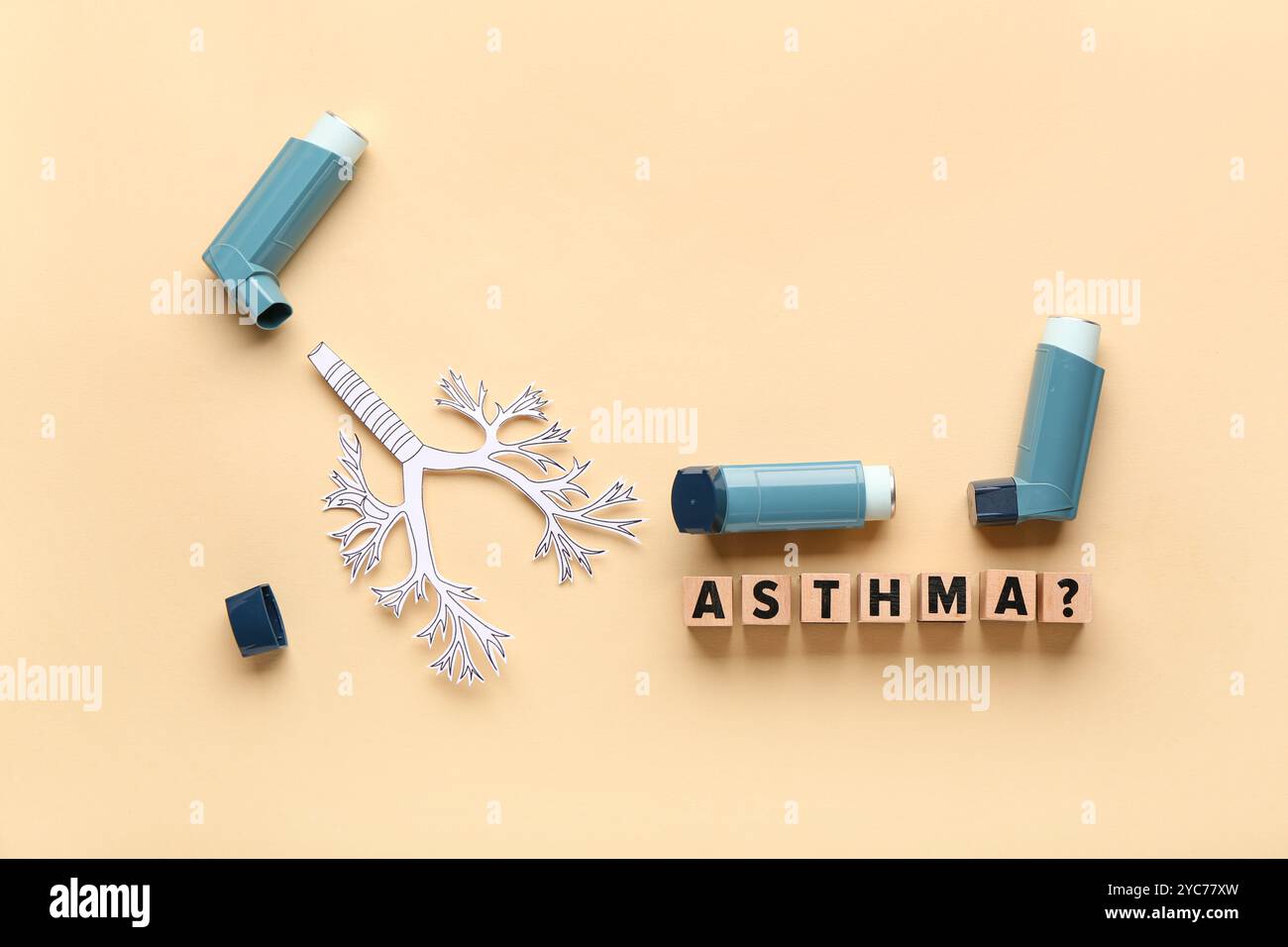 Inhalers, paper lungs and wooden cubes with text ASTHMA? on beige ...