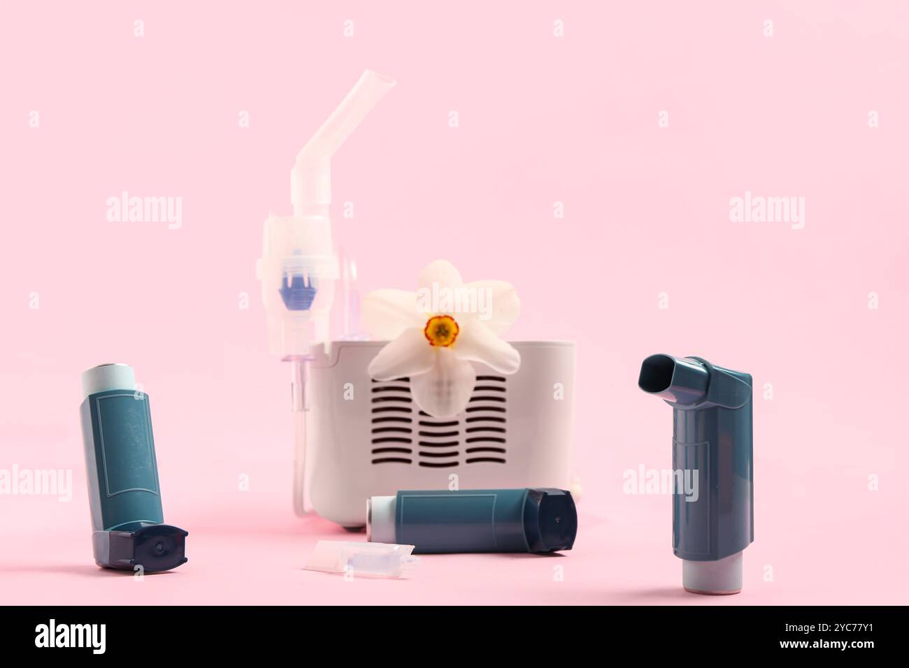 Modern inhalers and daffodil flower on pink background Stock Photo - Alamy