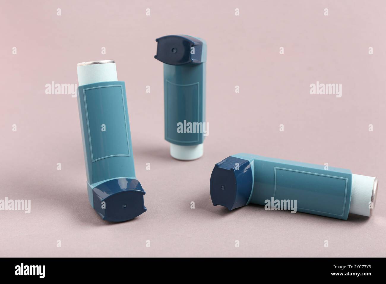Modern inhalers on grey background Stock Photo - Alamy