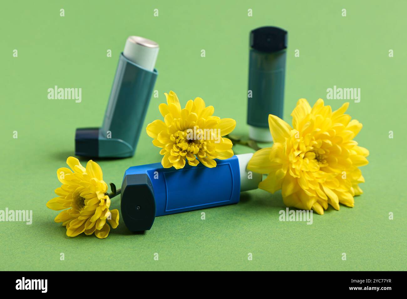 Modern inhalers and chrysanthemum flowers on green background Stock ...