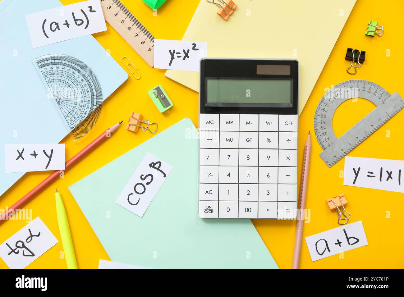 Calculator, school stationery, different math formulas and equations on yellow background Stock ...