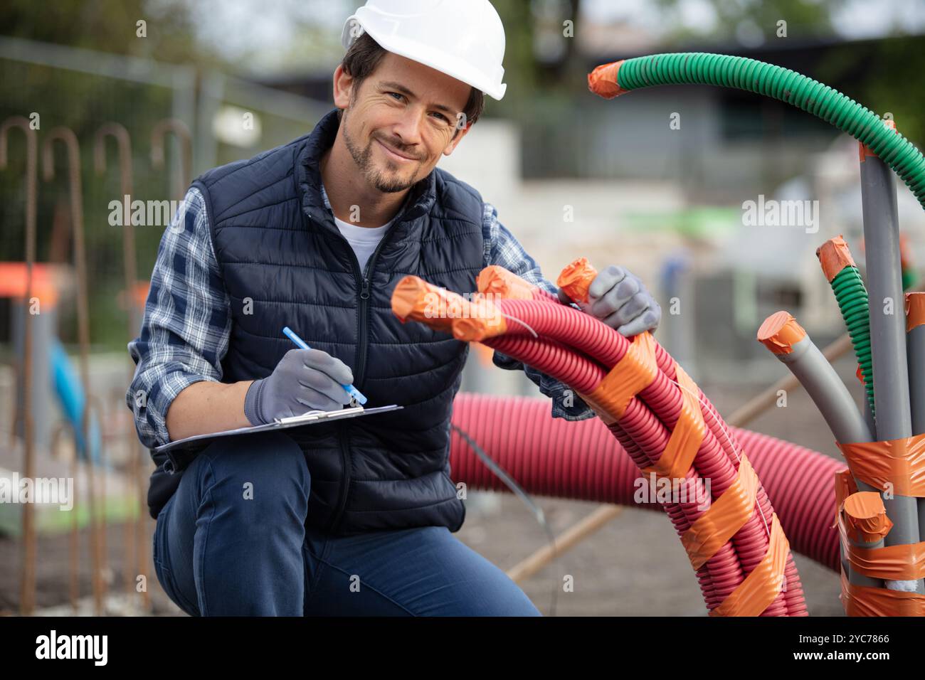 plumber assembling pvc sewage pipes in house foundation Stock Photo - Alamy