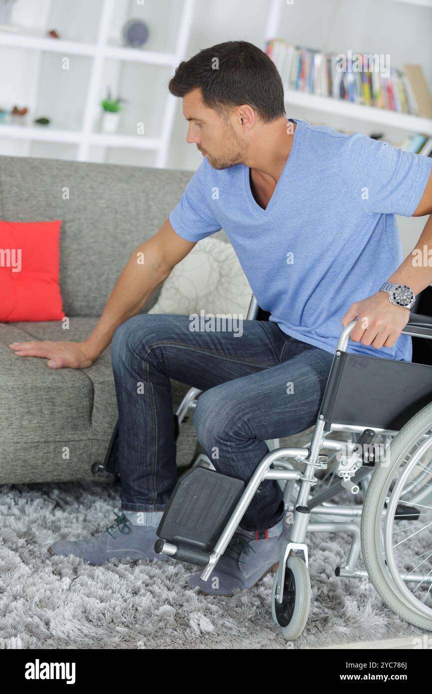 Handicapped man trying sit hi-res stock photography and images - Alamy
