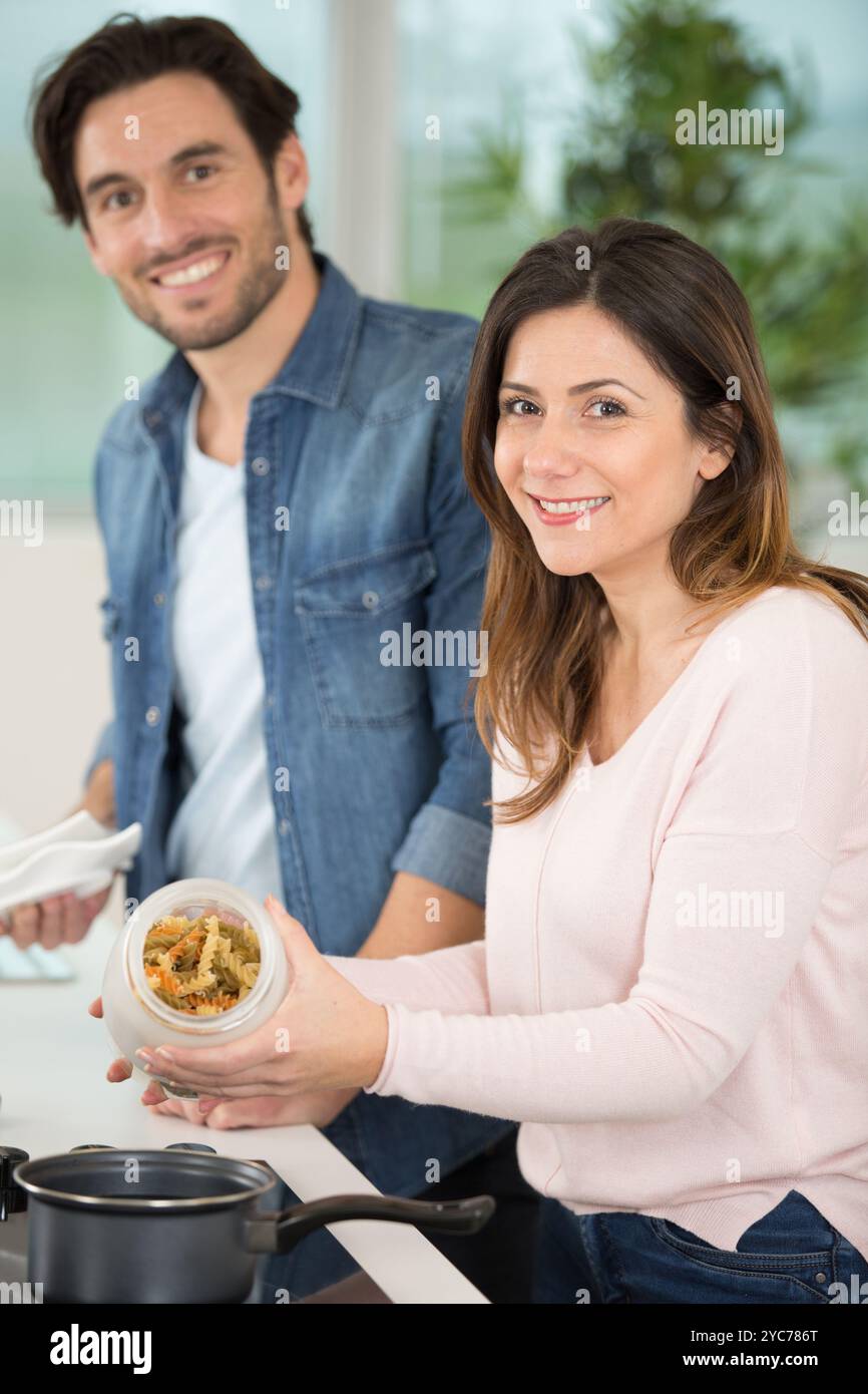 woman who drained pasta in a kitchen Stock Photo - Alamy