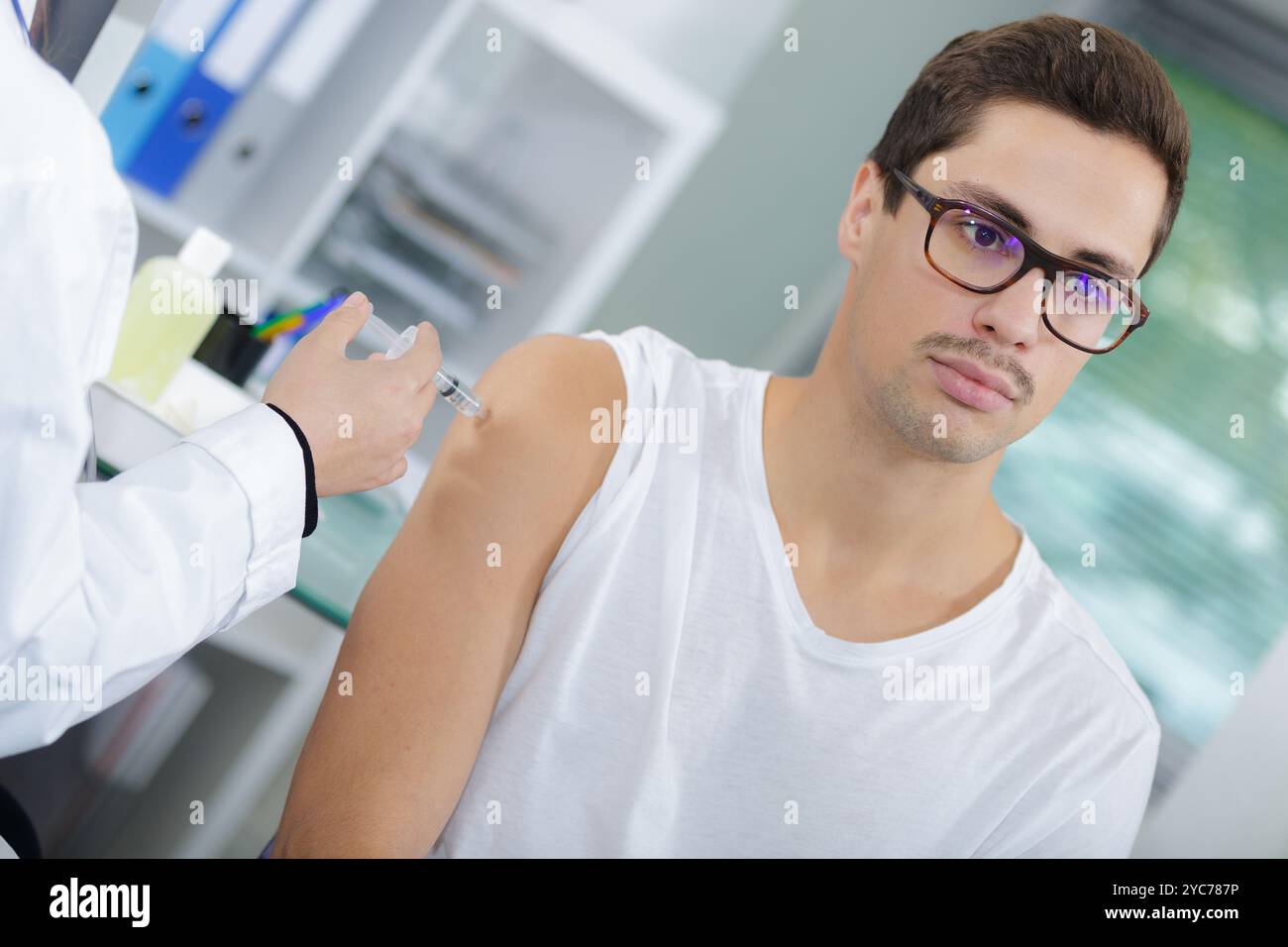 doctor doing tetanus toxoid injection in patient Stock Photo - Alamy