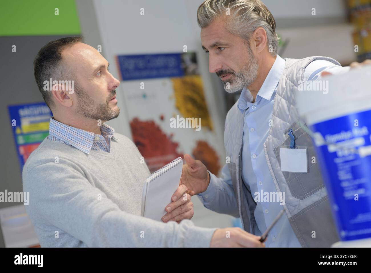 Two middle aged men in discussion Stock Photo - Alamy