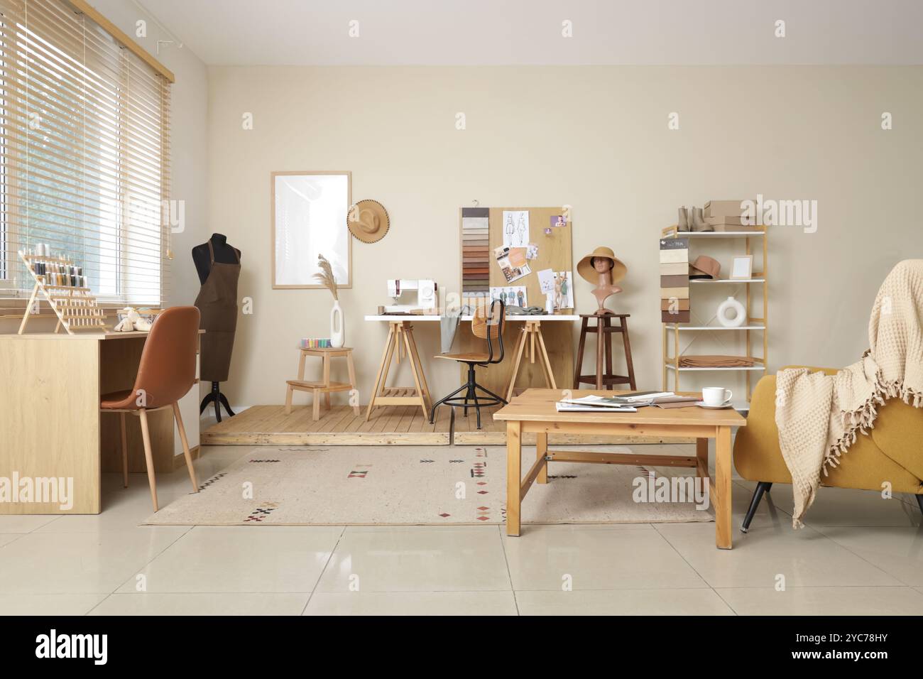 Interior of stylish atelier with tailor's workspace, mannequin and mood ...