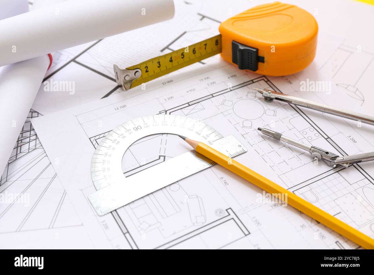 Architect's supplies on house plans, closeup Stock Photo - Alamy