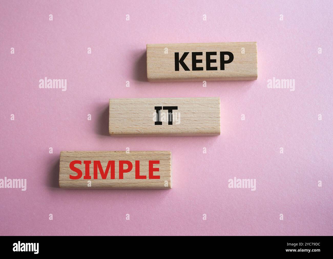 Keep it Simple symbol. Concept words Keep it Simple on wooden blocks ...