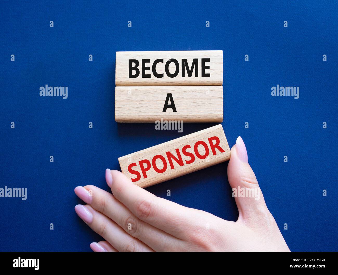 Become a sponsor symbol. Concept word Become a sponsor on wooden blocks ...