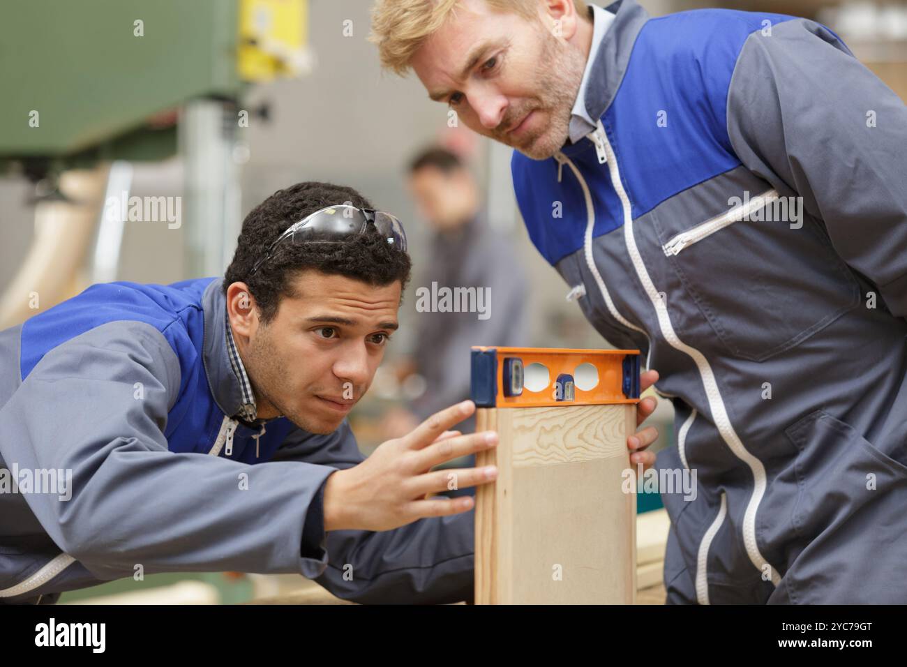 Men measure level hi-res stock photography and images - Alamy