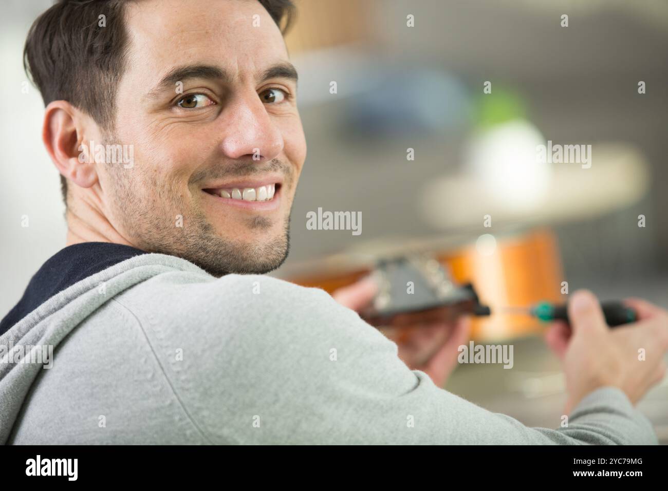 Happy man doing diy hi-res stock photography and images - Alamy