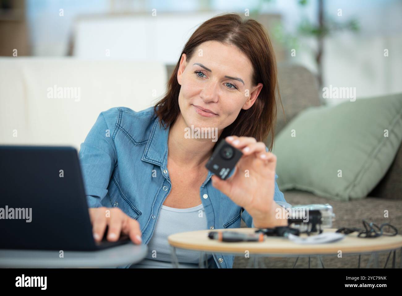 portrait of woman photographer loading files Stock Photo - Alamy