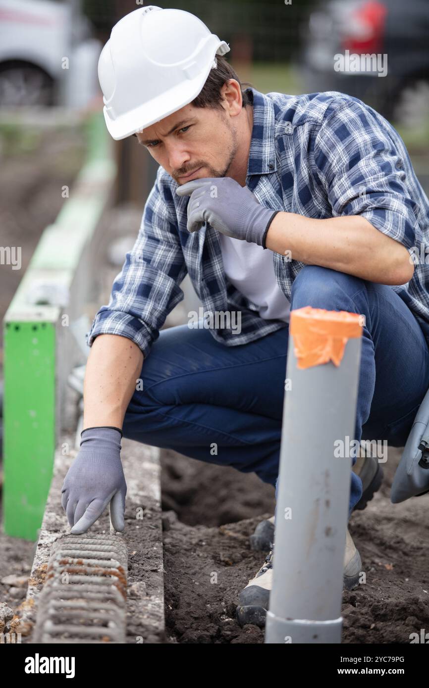 Plumber installing ground water pipe hi-res stock photography and ...