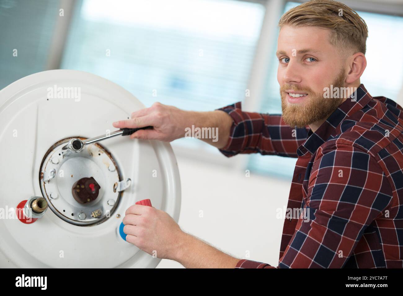 handsome male technician repairing appliance with screwdriver Stock ...