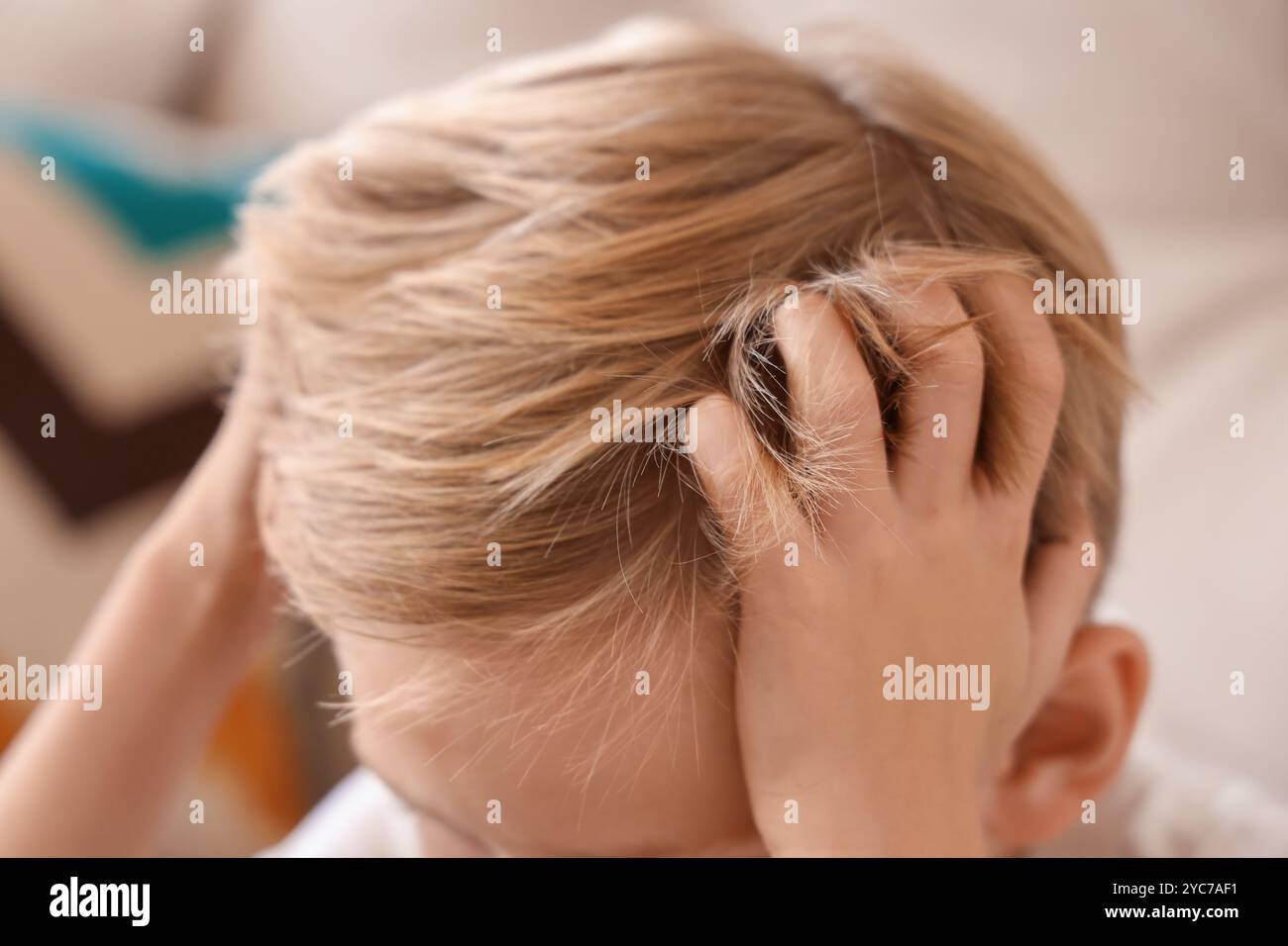 Little boy with pediculosis scratching his head at home, closeup Stock ...