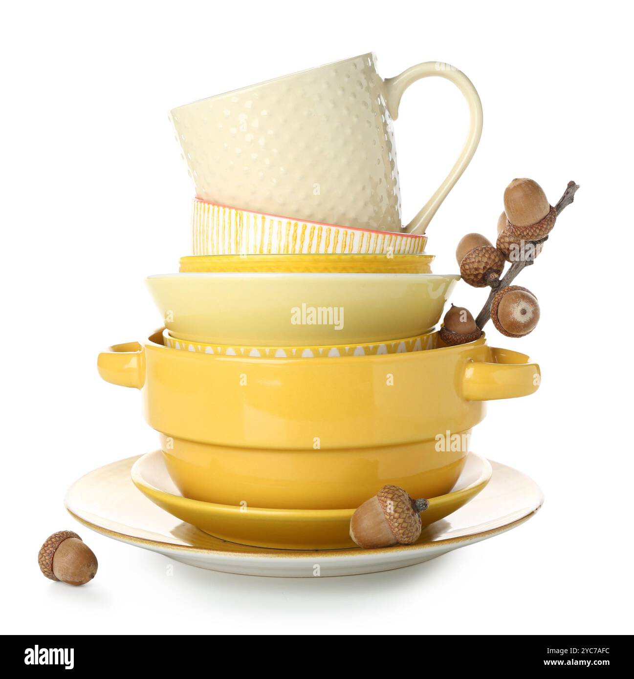 Stack of dishes with autumn decor and acorns on white background Stock ...