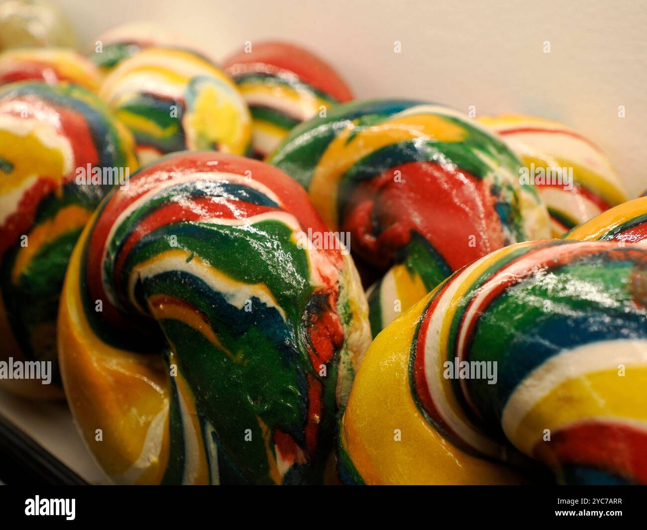 tasty rainbow donuts inside a bakery pastry in America Stock Photo - Alamy