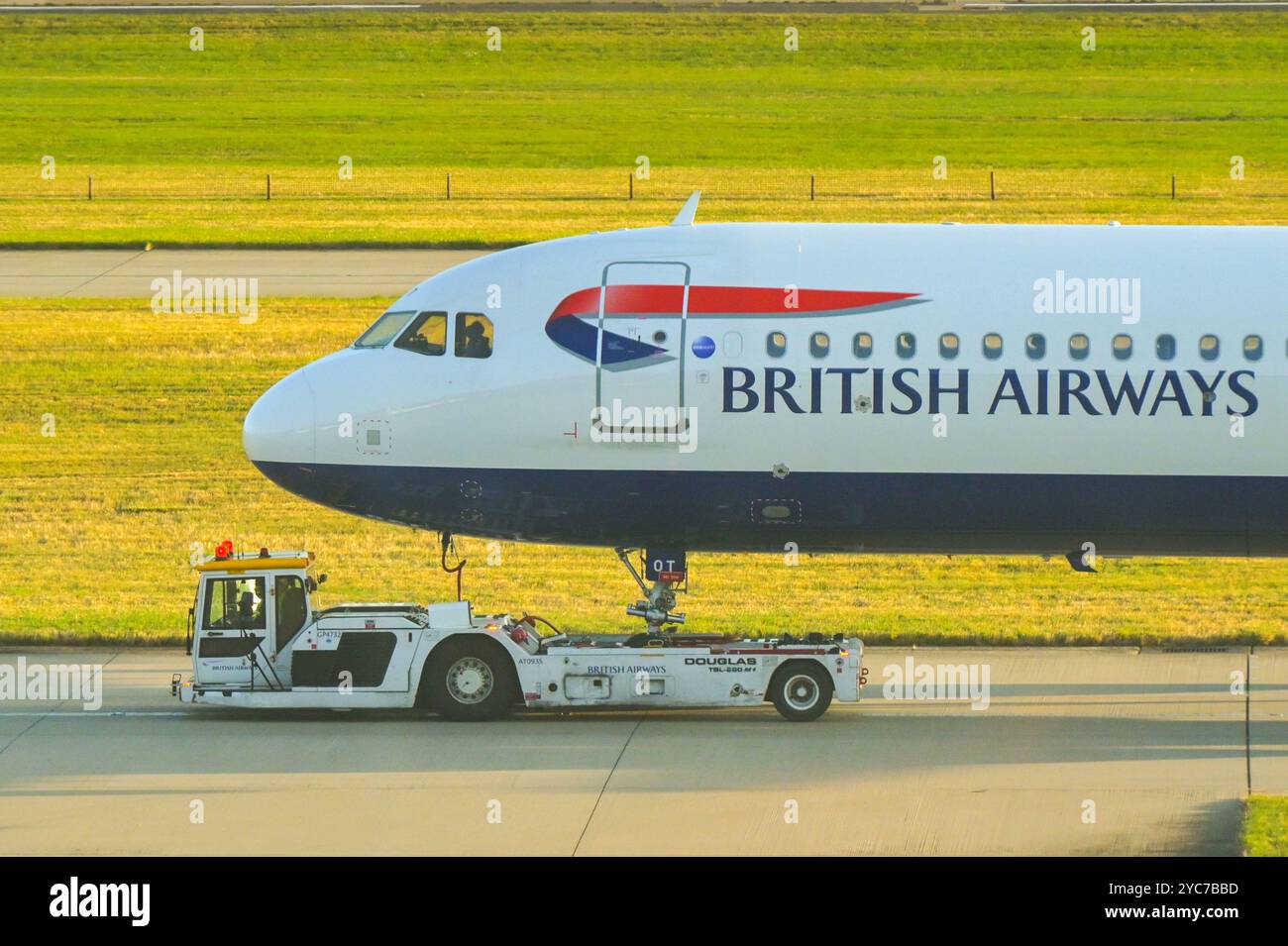 London, England, UK - 21 August 2024: Airport tug pulling a British ...