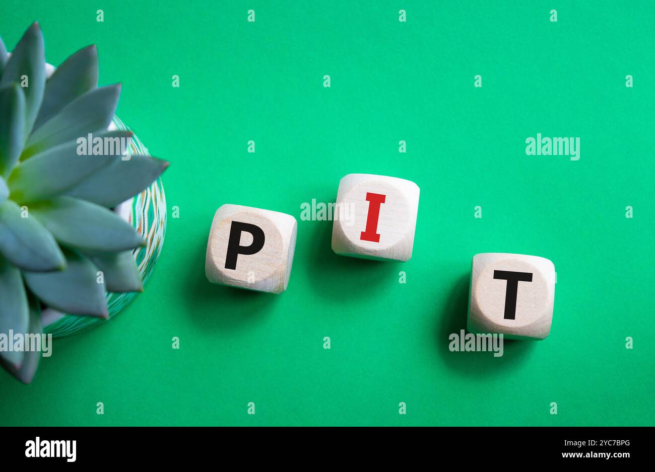 PIT - Personal Income Tax symbol. Wooden cubes with words PIT ...