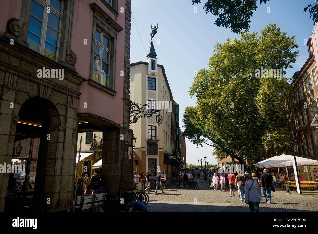 A street scene in the narrow streets of Altstadt, Düsseldorf’s old town, are home to chic ...