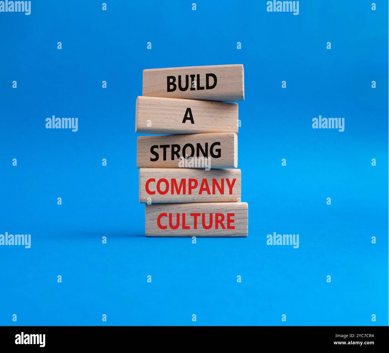 Company culture symbol. Wooden blocks with words Build a strong company ...
