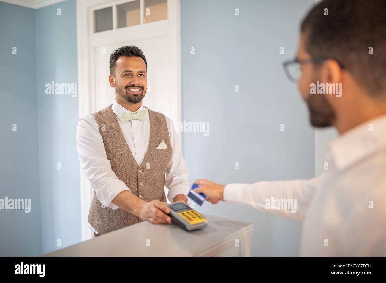 Assisting guest hi-res stock photography and images - Alamy