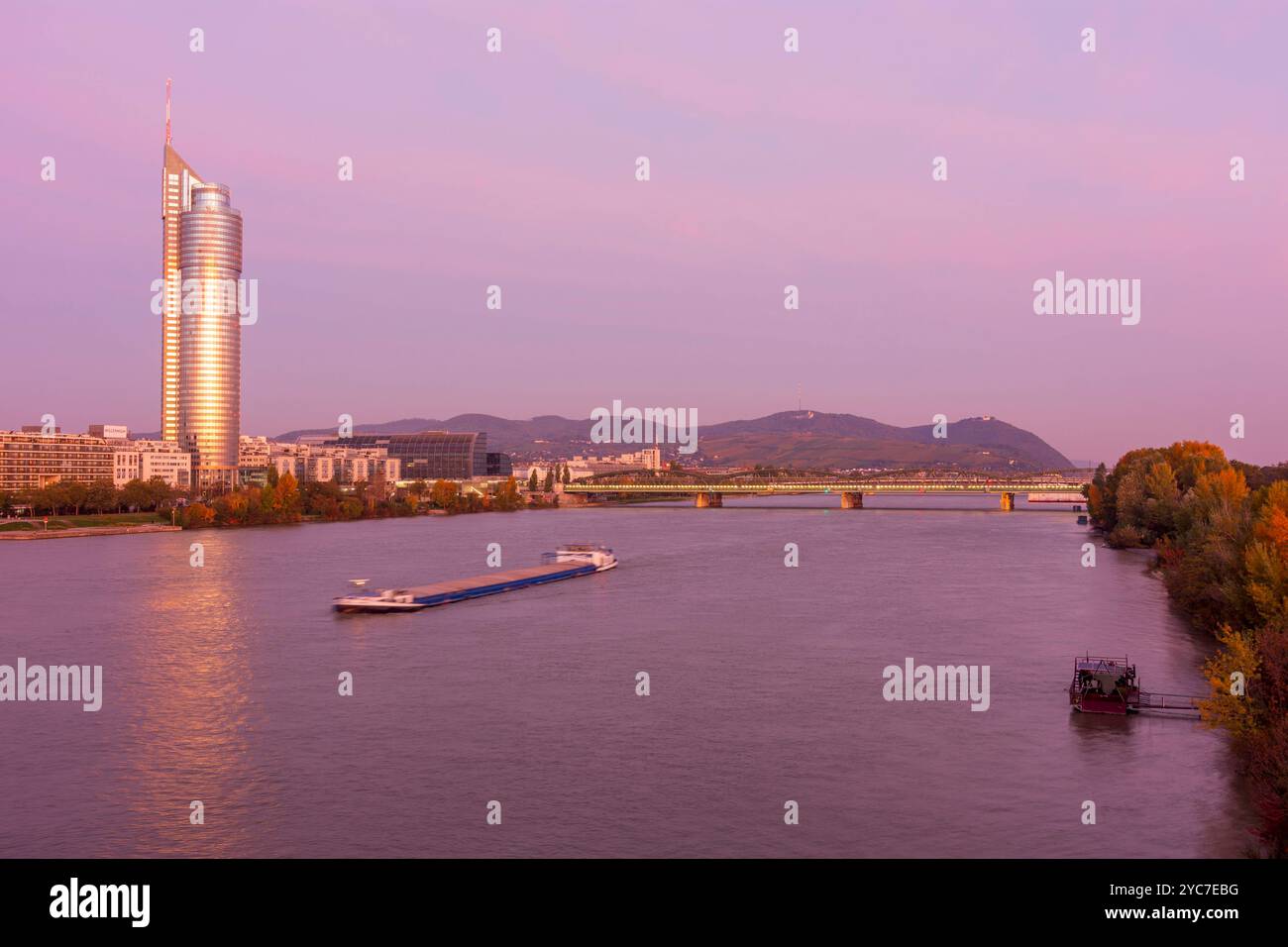river Donau Danube, cargo ship, Millennium Tower, island Donauinsel right, mountains Kahlenberg ...