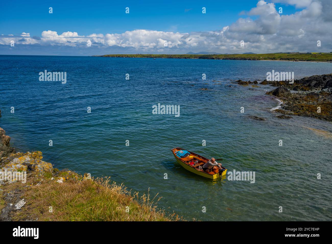 Fishing boat heading out to sea from Porth Colmon Llyn peninsula Wales ...