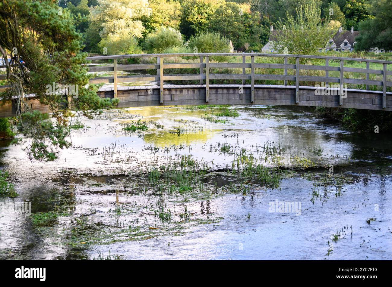 Wooden bridge over the river Coln at Bibury England Stock Photo - Alamy