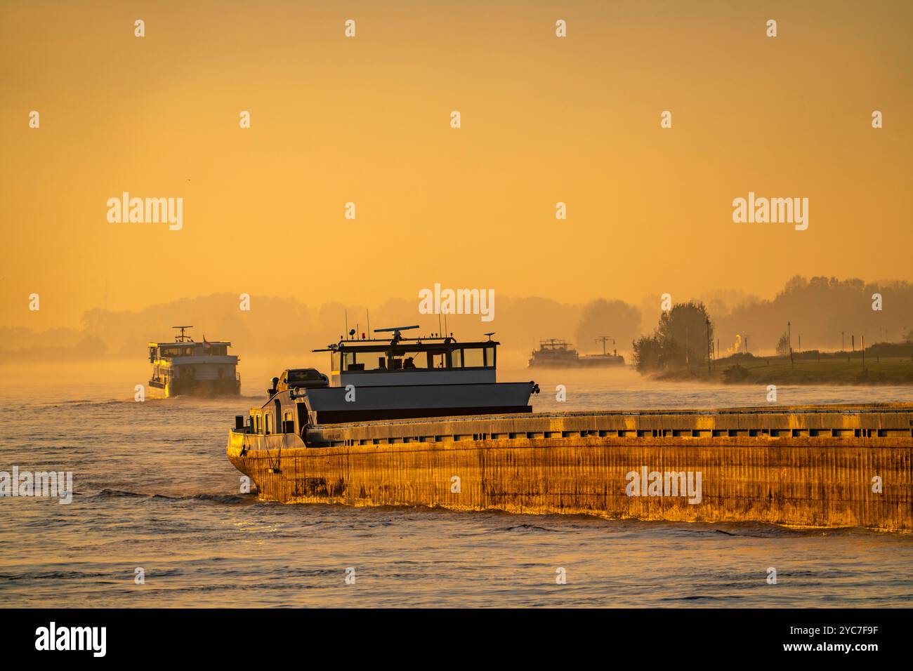 Cargo ships on the Rhine near Emmerich, early morning, sunrise, fog ...