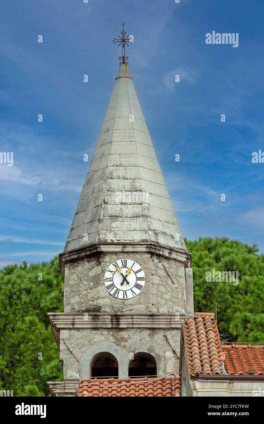 Old Catholic church with cone style dome and tower clock Stock Photo ...