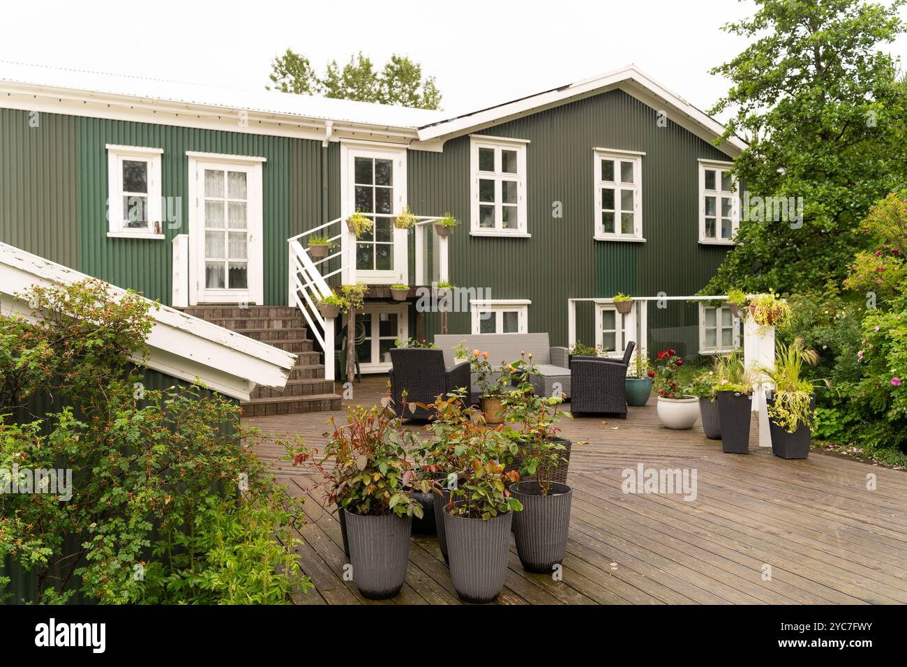 Lots of Flower Vases next to a wooden house Stock Photo - Alamy