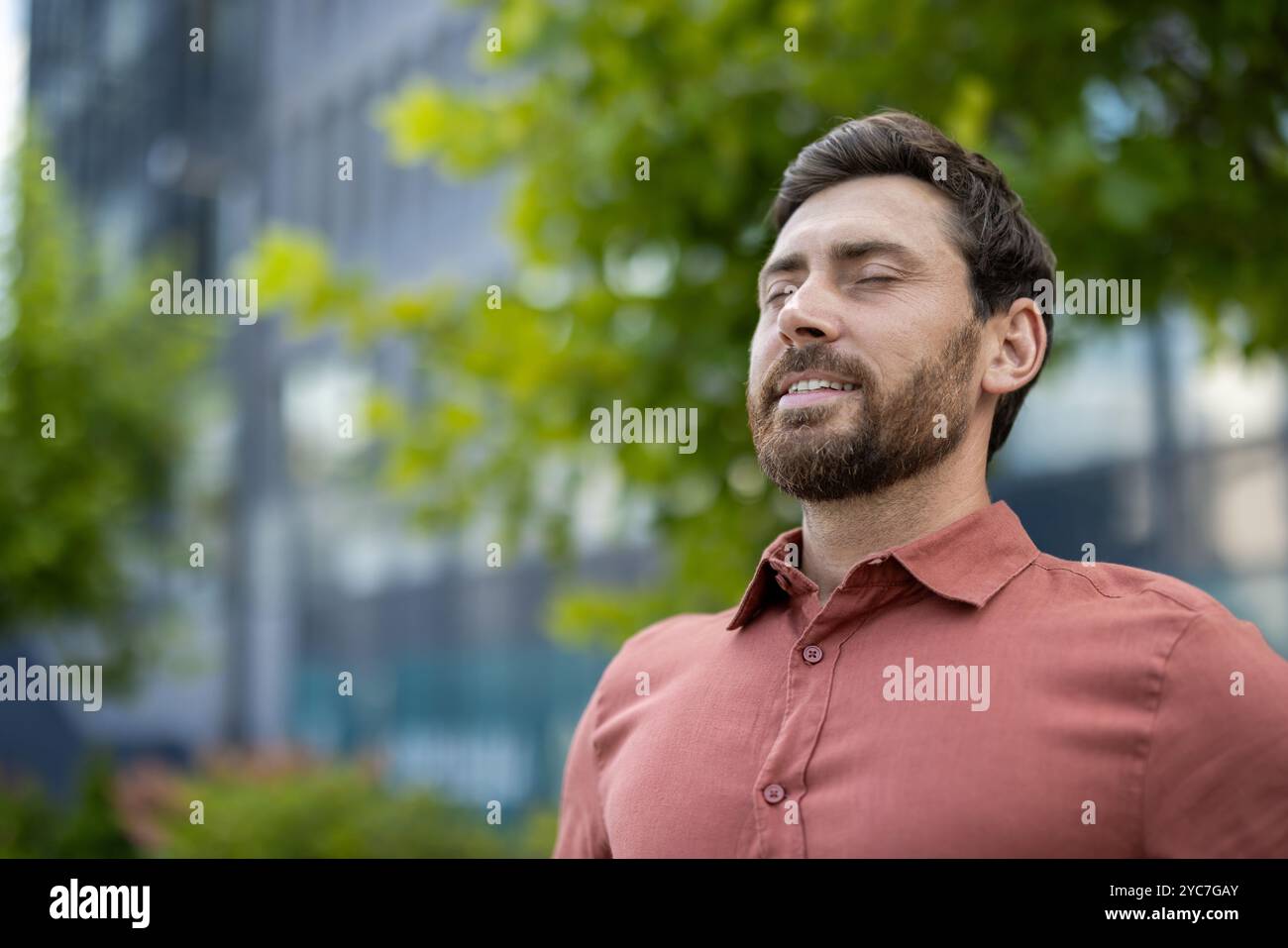 Confident man captures a moment of mindfulness during office break ...
