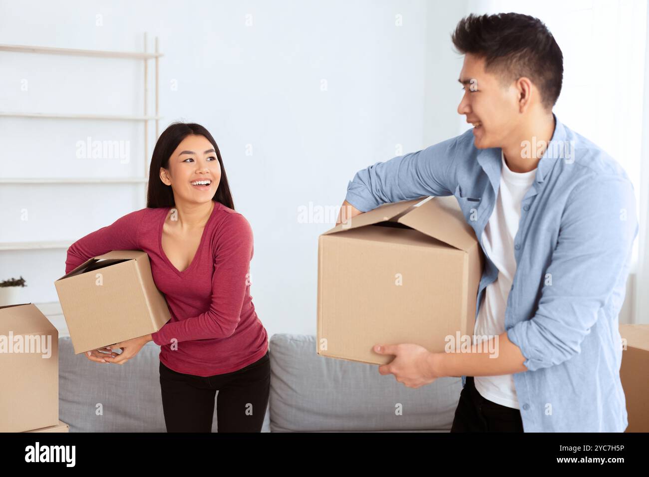 Happy asian family celebrating their moving day Stock Photo - Alamy